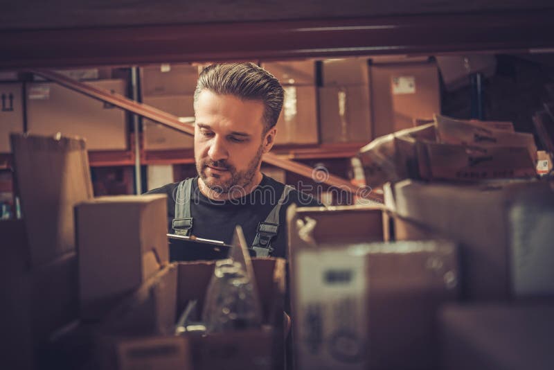 Storekeeper with Manual Pick List on a Warehouse Stock Photo - Image of ...