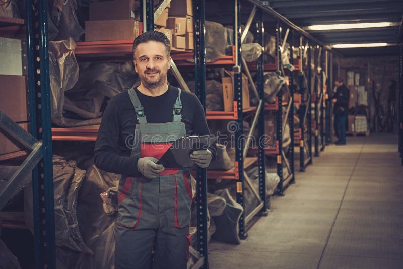 Storekeeper with Manual Pick List on a Warehouse Stock Image - Image of ...