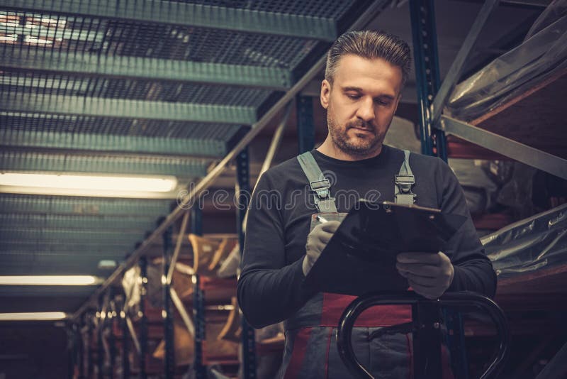 Storekeeper with Manual Pick List on a Warehouse Stock Image - Image of ...
