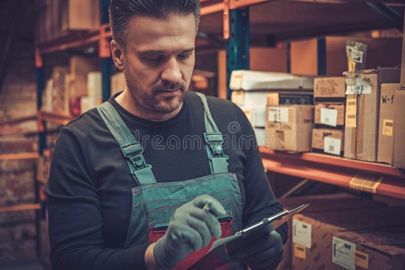 Storekeeper with Manual Pick List on a Warehouse Stock Image - Image of ...