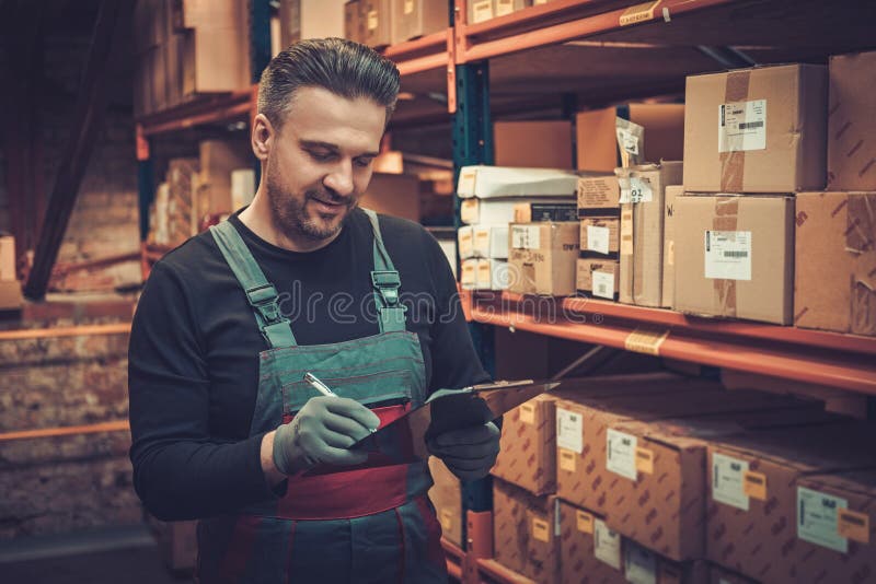 Storekeeper with Manual Pick List on a Warehouse Stock Image - Image of ...