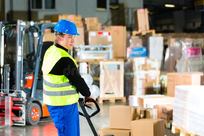 Storeman with Mover at Warehouse of Forwarding Stock Photo - Image of ...