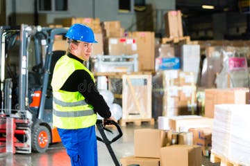 Storeman with Mover at Warehouse of Forwarding Stock Photo - Image of ...
