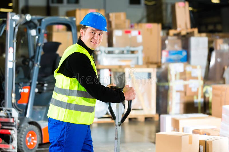 Storeman with Mover at Warehouse of Forwarding Stock Photo - Image of ...