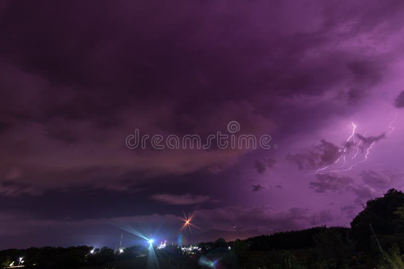 Storm and Bright Lightning Strike at Dusk at Night Stock Photo - Image ...