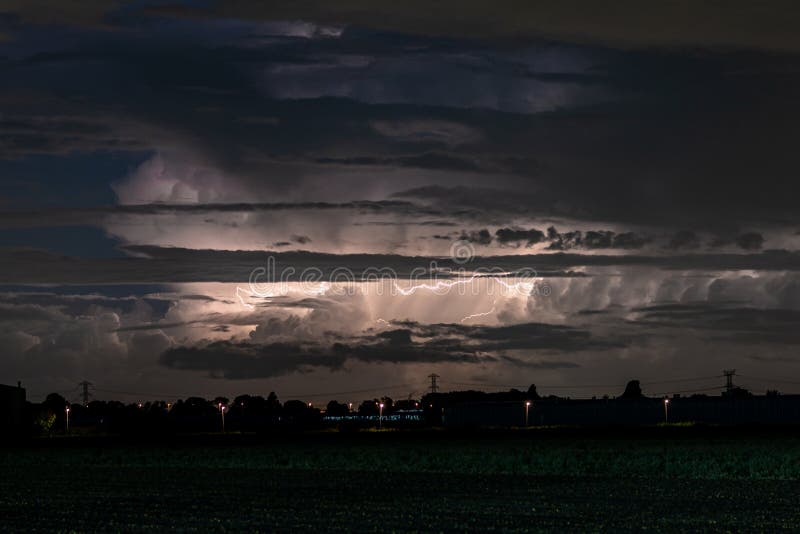 Storm Cloud is Lit Up by Lightning Stock Photo - Image of discharge ...