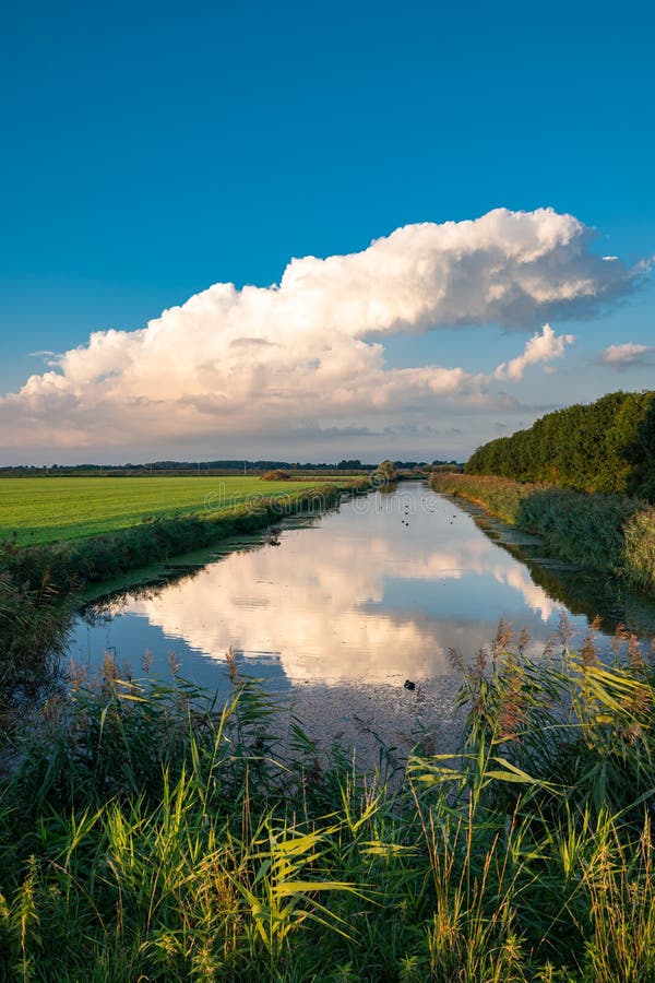 Storm Cloud is Reflected in Calm Water Stock Image - Image of cloud ...