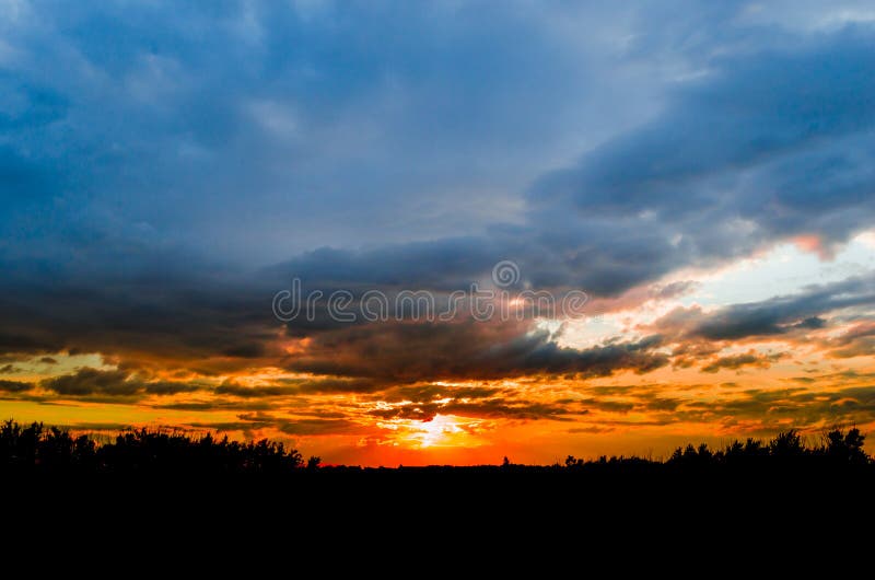 Storm Clouds Against a Bright Blue Sky,sunset. Stock Image - Image of ...