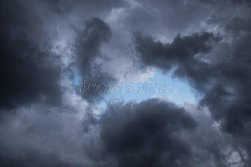 Storm Clouds in the Blue Sky Background. Darkness and Light. Good and ...