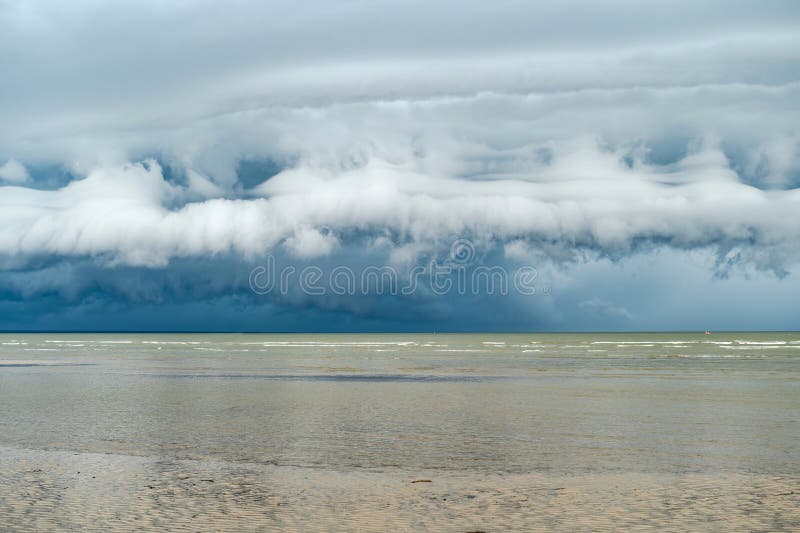 Storm Clouds Forming Over a Beach. Dense, Towering Raincloud before the ...