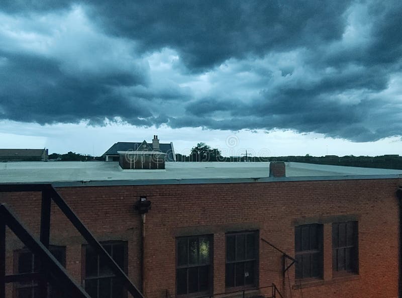 Storm Clouds stock image. Image of building, storm, gathering - 394569109