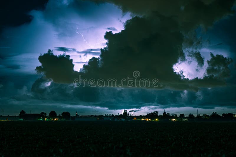 Storm Clouds at Night with Distant Lightning Bolts Stock Image - Image ...