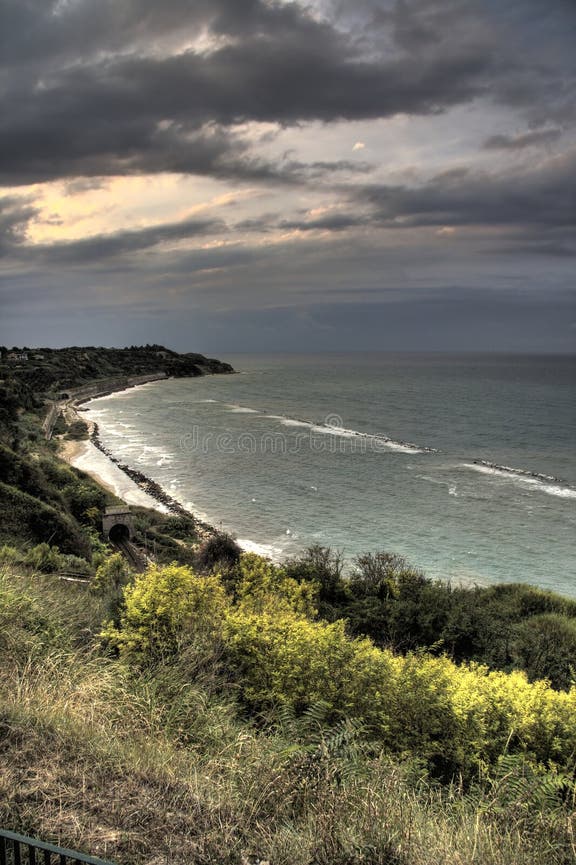 Storm Clouds Over Coastline Stock Photo - Image of coast, receding ...