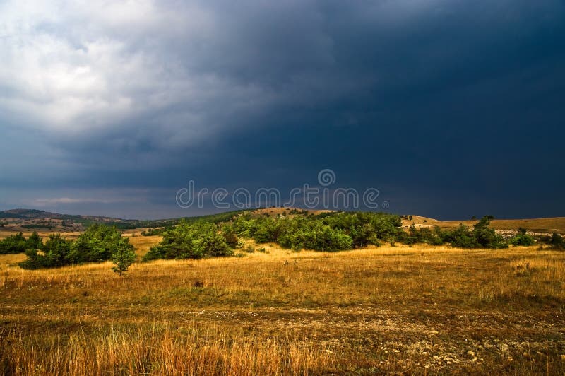 Storm Clouds Over Countryside Stock Photo - Image of nature, yellow ...