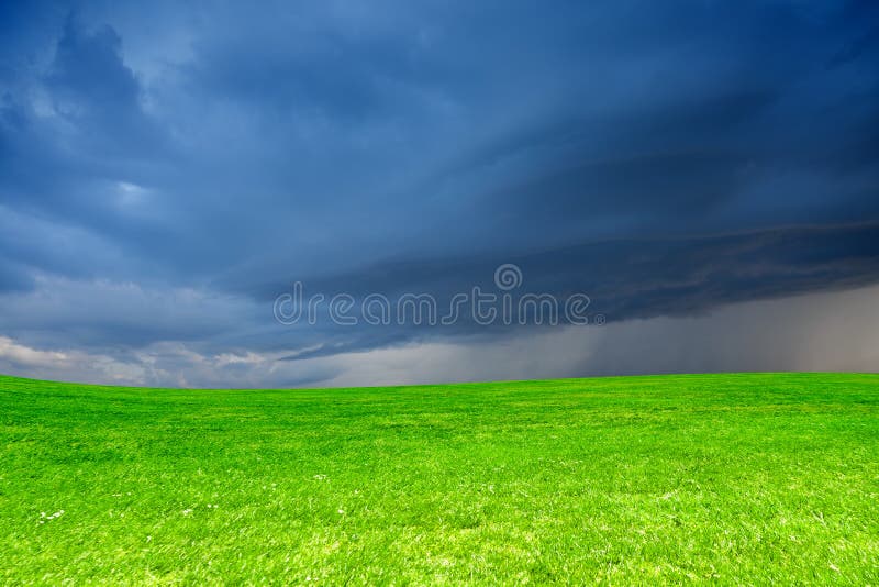 Storm Clouds Over a Green Meadow in the Spring Season. Natural ...