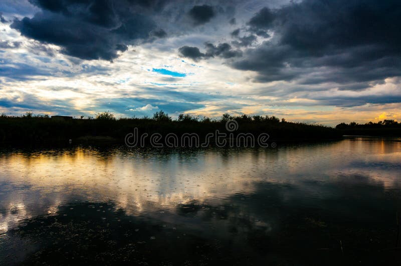 Storm Clouds Over Lake Shore Stock Image - Image of rain, cloudy: 61722287