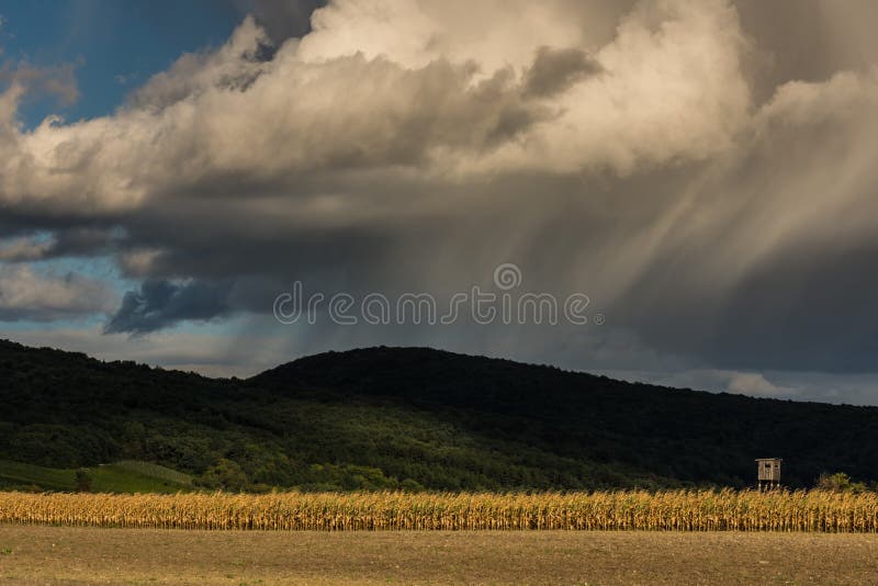 Storm Clouds Over a Mountain and Field Stock Image - Image of aircraft ...