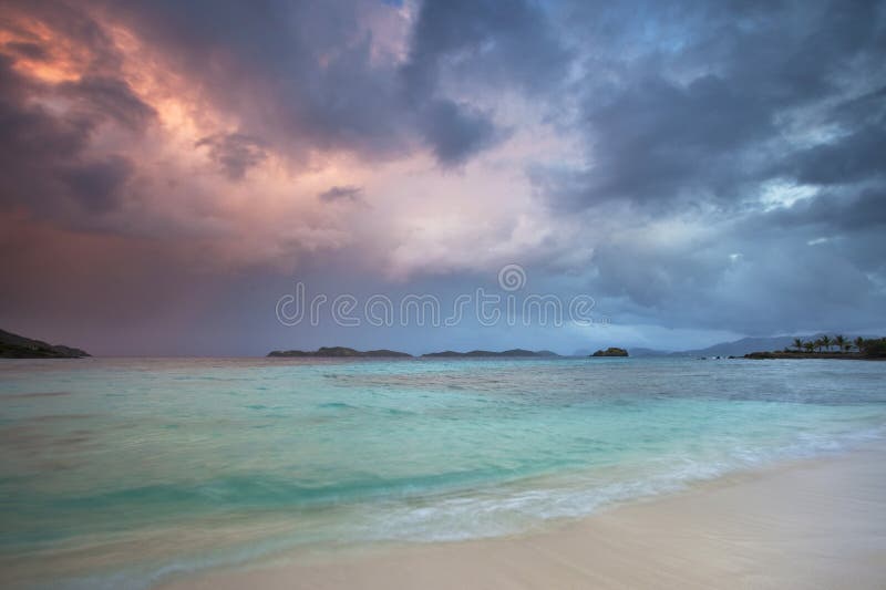 Storm Clouds Over a Tropical Beach Stock Photo - Image of scenic, beach ...
