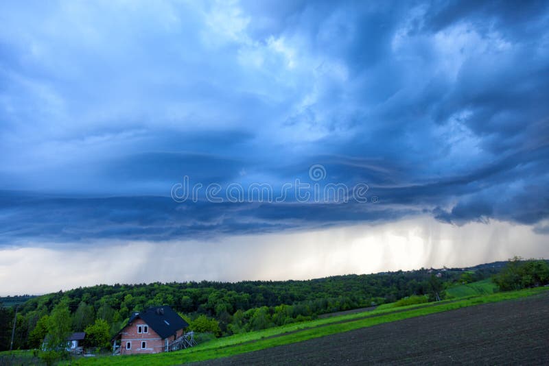 Storm Clouds Over the Village in the Spring Season. Natural Background ...