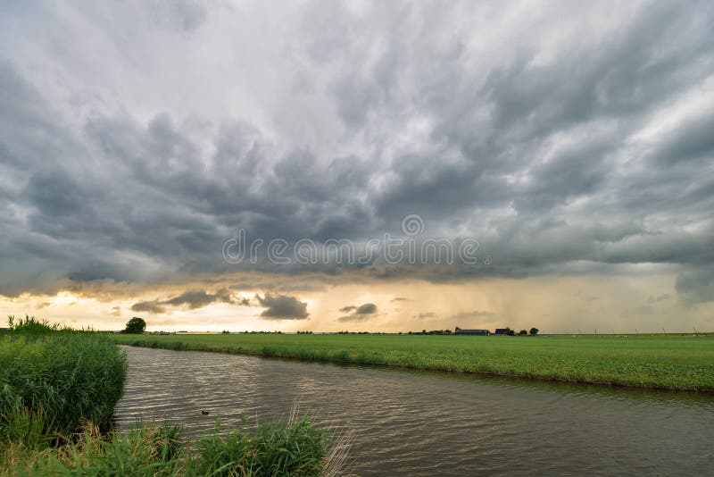Storm Clouds Over Wide Open Flat Landscape Stock Photo - Image of ...