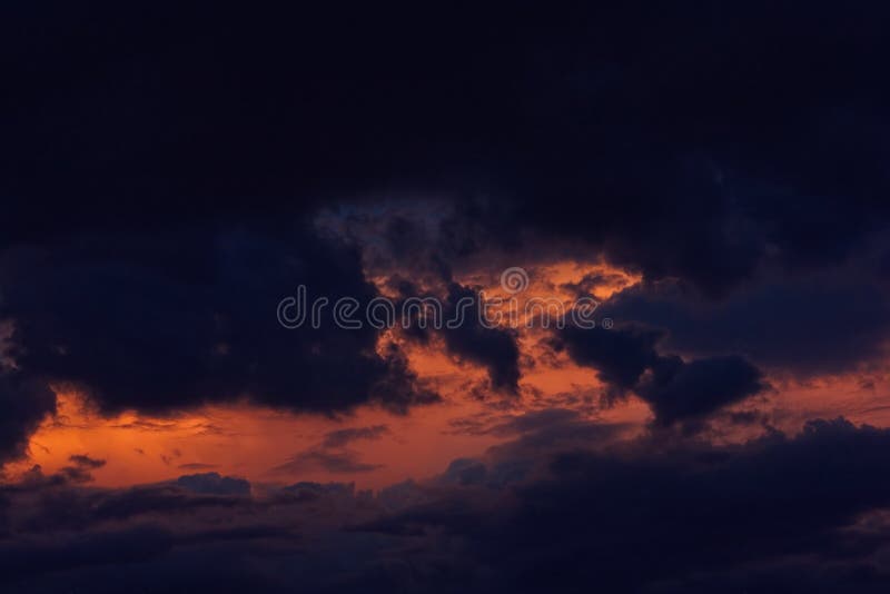 Storm Clouds after Sunset with Orange Glow Inside. Stock Photo - Image ...