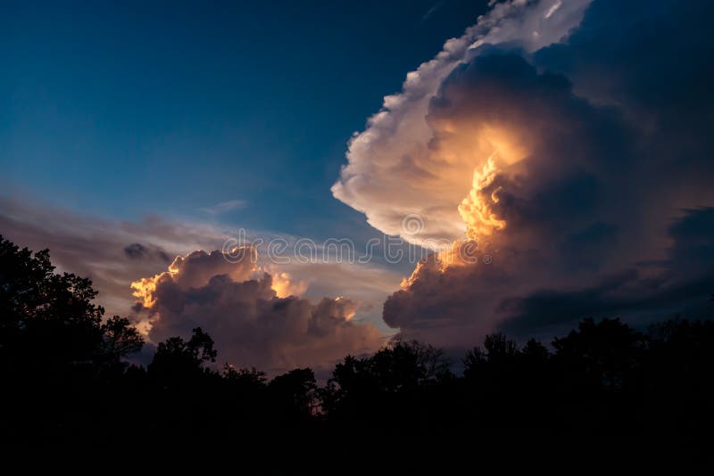 Storm Clouds at Sunset stock photo. Image of storm, rolling - 76525784