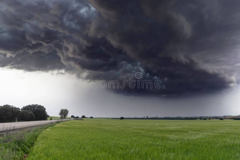 Storm Forming Dark Clouds Over Green Grass Field. Stock Image - Image ...