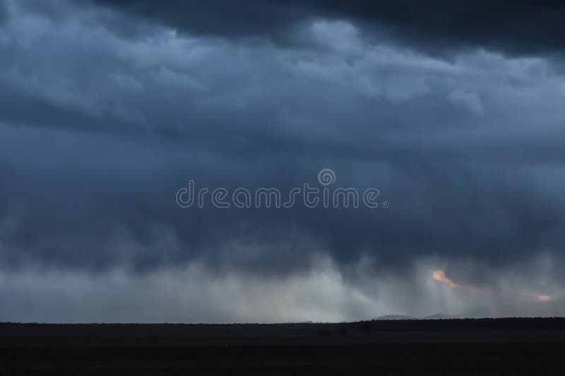 Storm Front with Dark Clouds and Rain after Sunset Stock Photo - Image ...