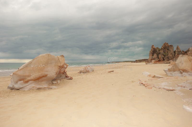 Storm Over Ocean with Dark Clouds and Long Stretch of Remote Beach ...