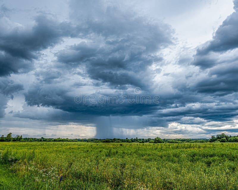 Storm Rain Clouds Forming Over the Countryside Fields in Green Summer ...