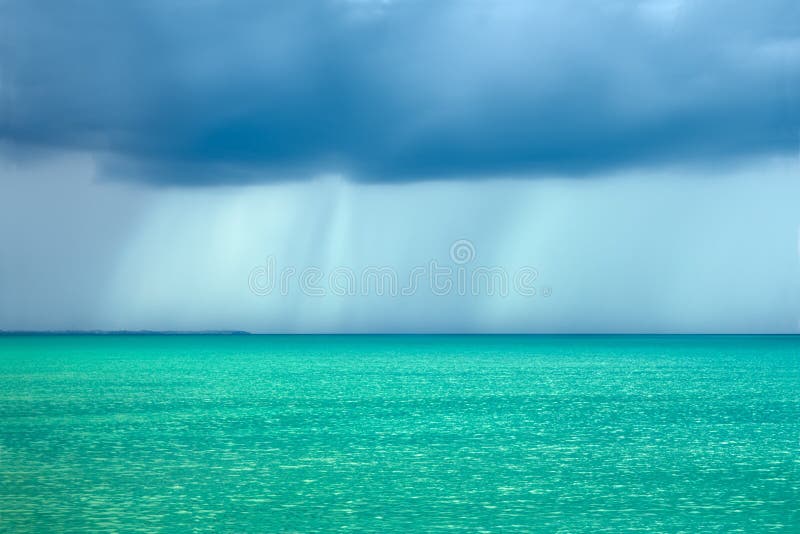 Storm Rain Clouds Over the Turquoise Sea Stock Photo - Image of ...