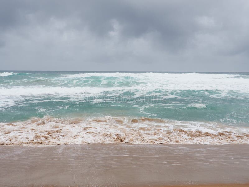 Storm sea and sand stock photo. Image of ocean, blue - 78577666