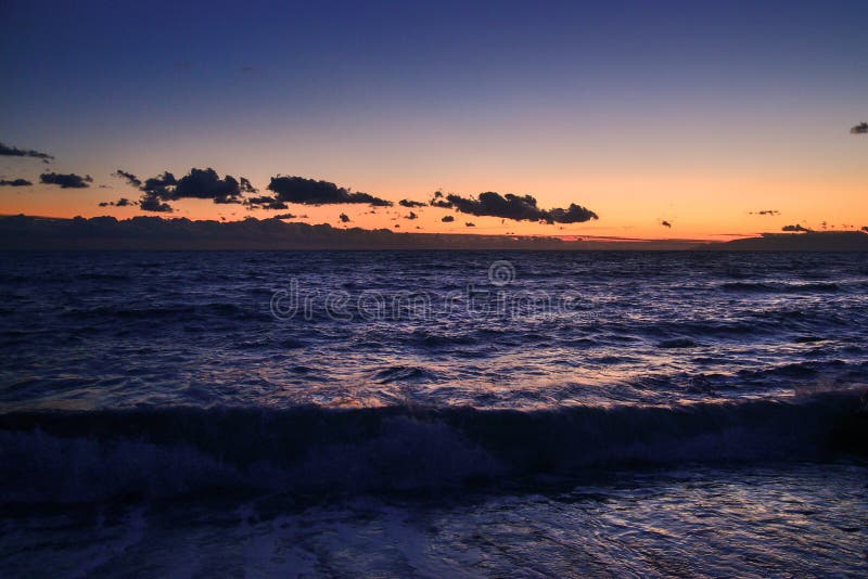 Storm on the sea at sunset stock photo. Image of storm - 137214074