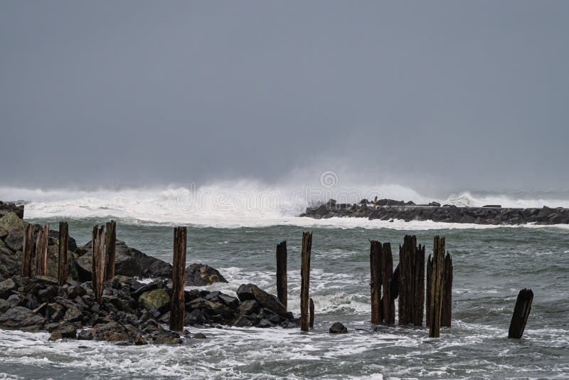 Storm Surge Creates High Waves Crashing on a Jetty Stock Photo - Image ...