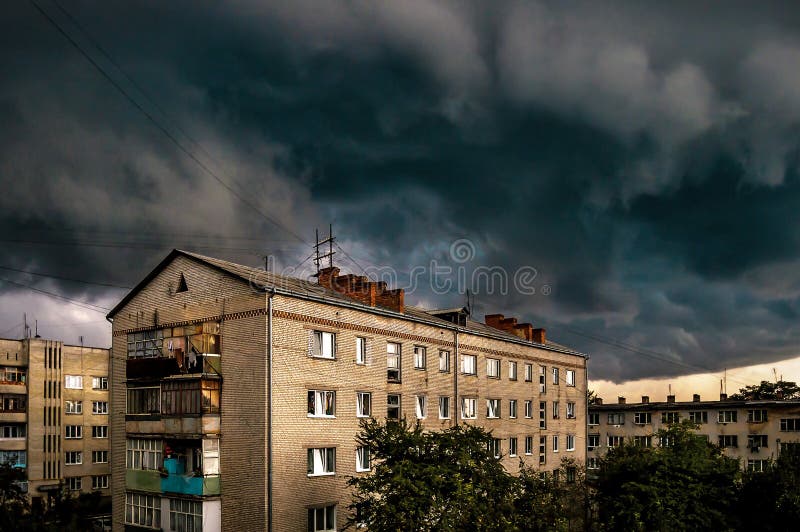 Stormy Clouds Over Old Apartment Building Stock Photo - Image of scene ...