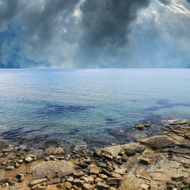 Stormy day on beach stock photo. Image of clouds, mediterranean - 131859952