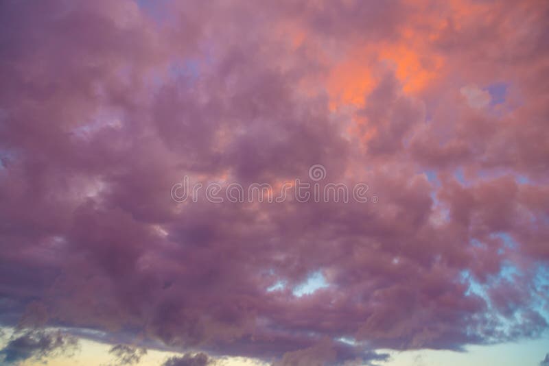 Stormy Setting Sun with Warm Light Illuminates Dark Blue Clear Sky with ...