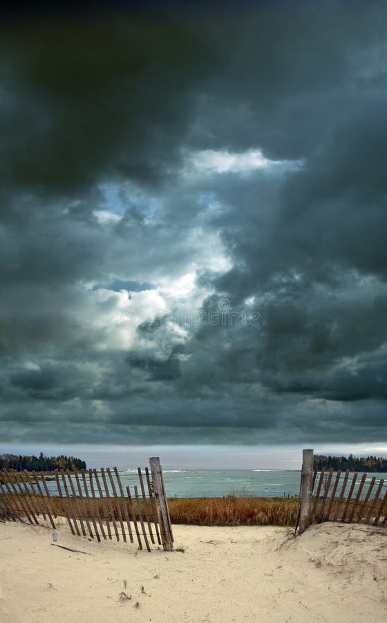 Stormy Sky at the Beach with Fence Stock Image - Image of door, grass ...