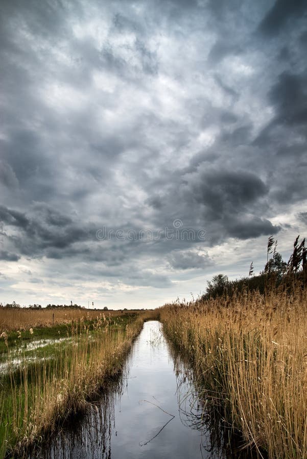 Stormy Sky Over Bright Countryside Landscape Stock Photo - Image of ...