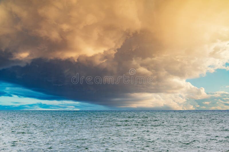 Stormy Sky Over the Calm Surface of the Sea Stock Photo - Image of ...