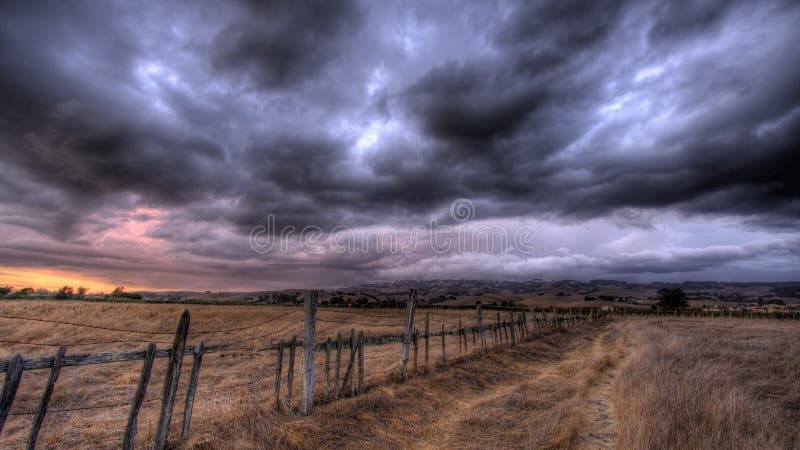 Stormy Sky Over Field with Fence Stock Illustration - Illustration of ...