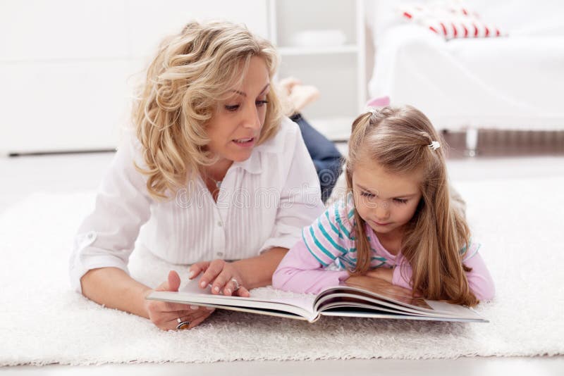 Story Time - Happy Family with a Child Stock Photo - Image of ...