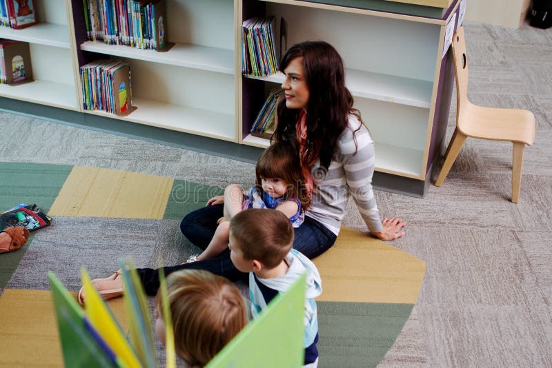 Story time at the library stock photo. Image of person - 51033230