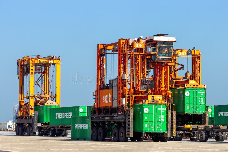Straddle Carrier Used for Moving Containers in a Container Terminal ... Straddle Carrier Used for Moving Containers in a Container Terminal ...