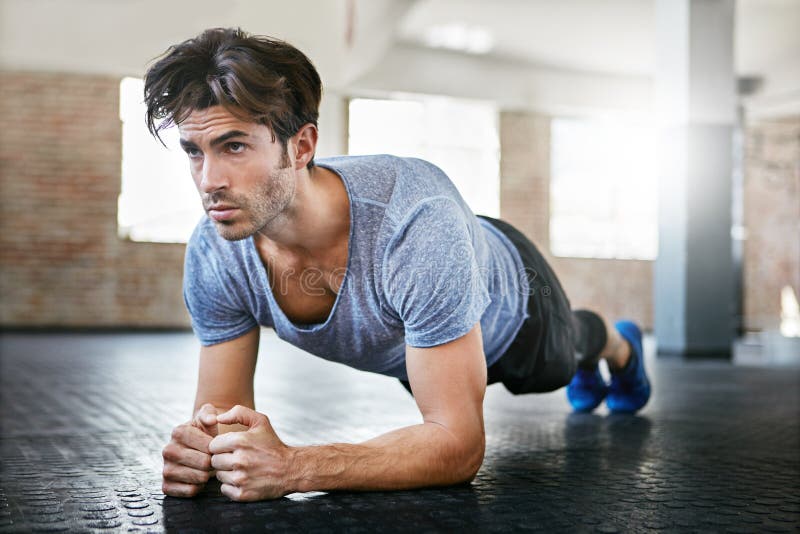 Straight As a Plank. a Young Man Working Out in the Gym. Stock Photo ...