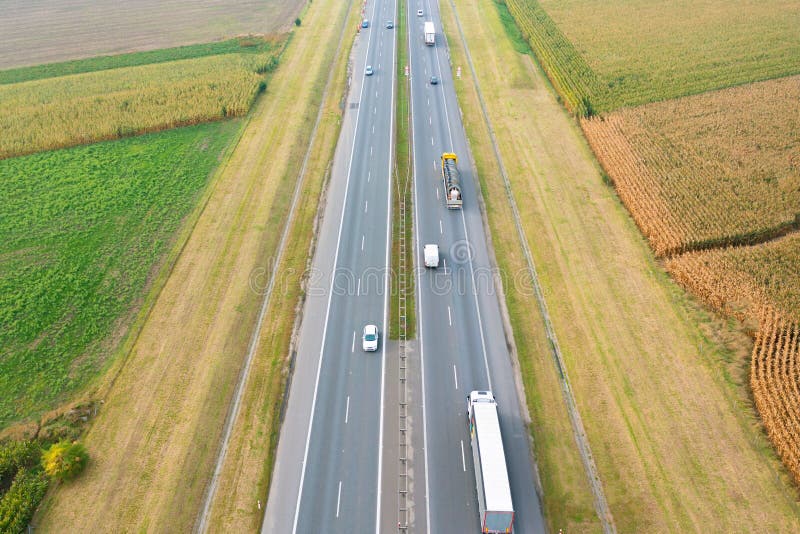 Straight Asphalt Road Going through Yellow-green Fields Stock Image ...