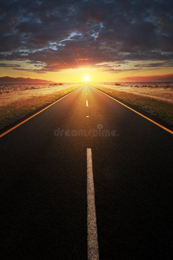 Straight Asphalt Road Leading into Sunlight Stock Photo - Image of dawn ...