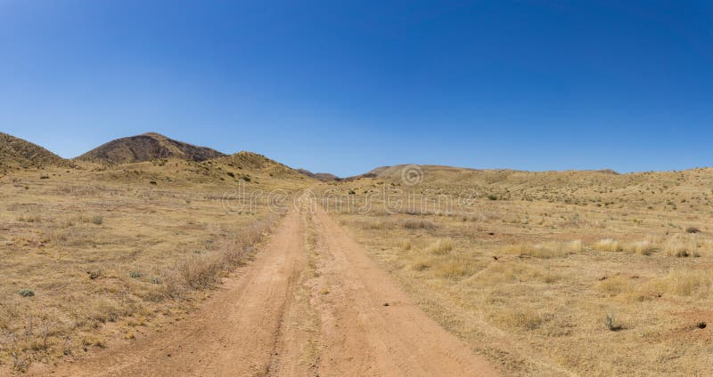 Straight Dirt Road through Dry Grassland Stock Image - Image of public ...