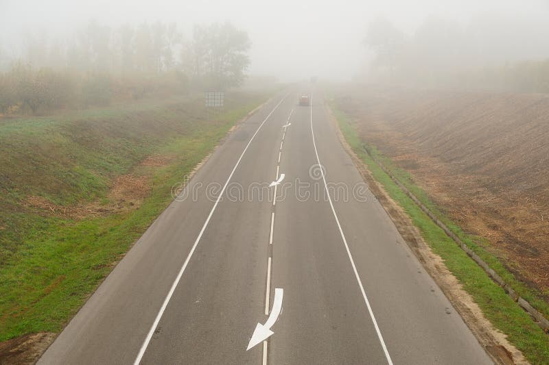 Straight Empty Road in Heavy Mist in Autumn Morning Stock Image - Image ...