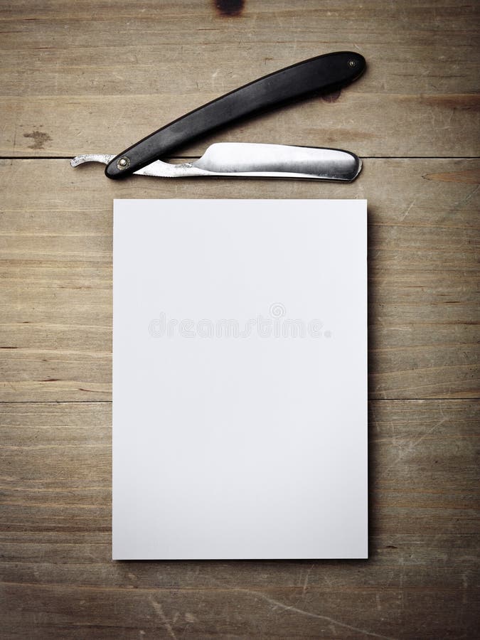 Straight Razor and White Paper on Wood Desk Stock Photo - Image of ...